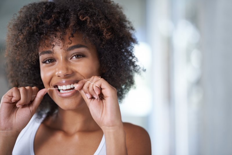 A Step-by-Step Guide to Flossing with Invisalign - Wolfe Dental Blog